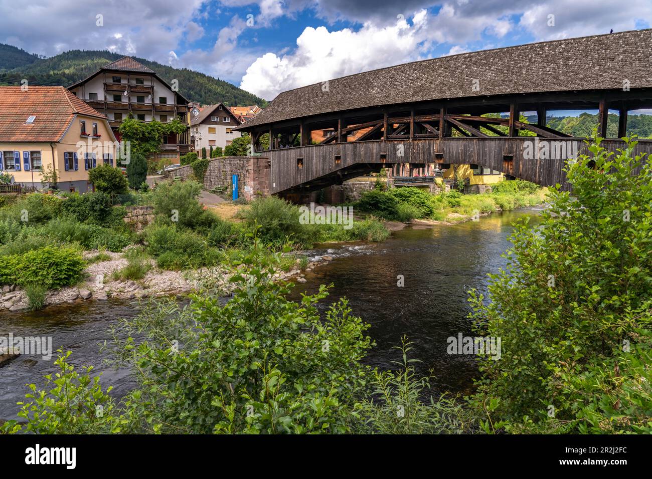 The covered wooden bridge over the Murg River in Forbach, Murg Valley ...