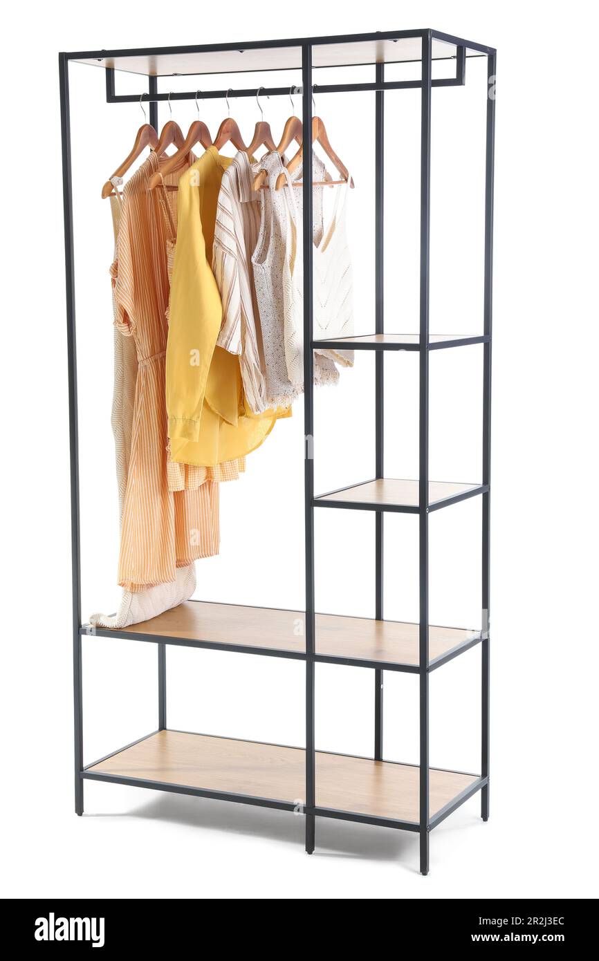 Shelving unit with summer clothes on white background Stock Photo - Alamy