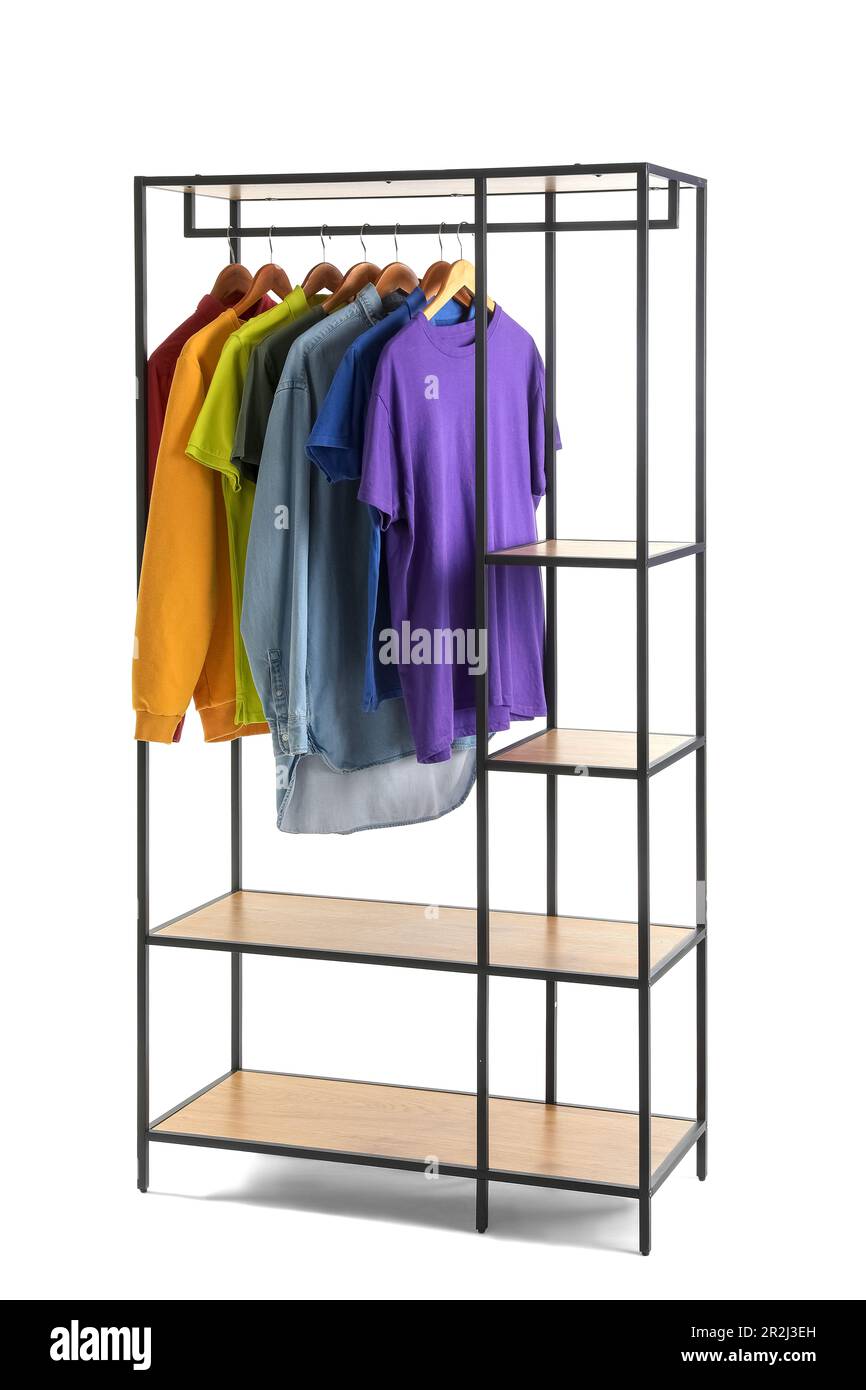 Shelving unit with male clothes on white background Stock Photo - Alamy