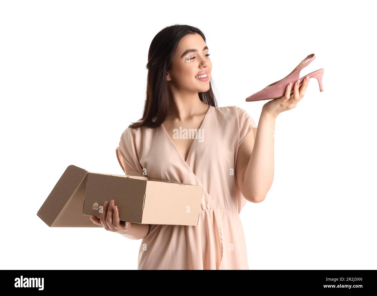 Young woman with shoe box on white background Stock Photo - Alamy