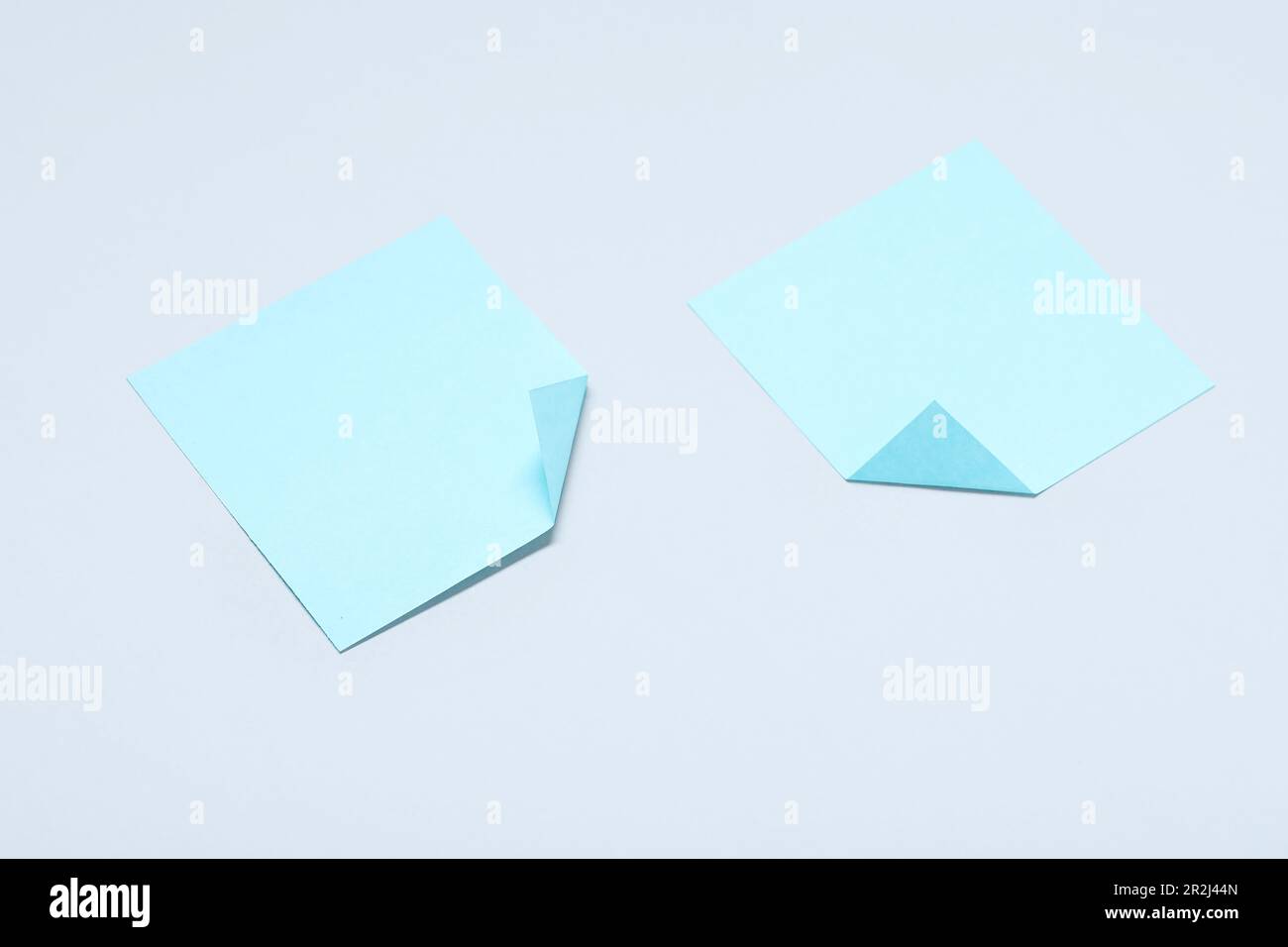 Blue sticky notes on grey background Stock Photo - Alamy