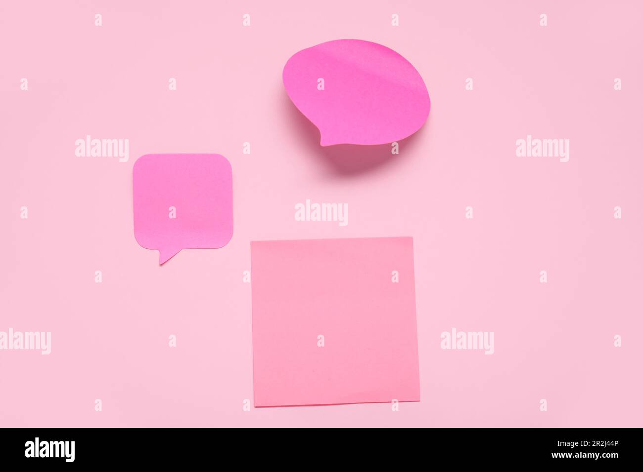 Different sticky notes on pale pink background Stock Photo - Alamy