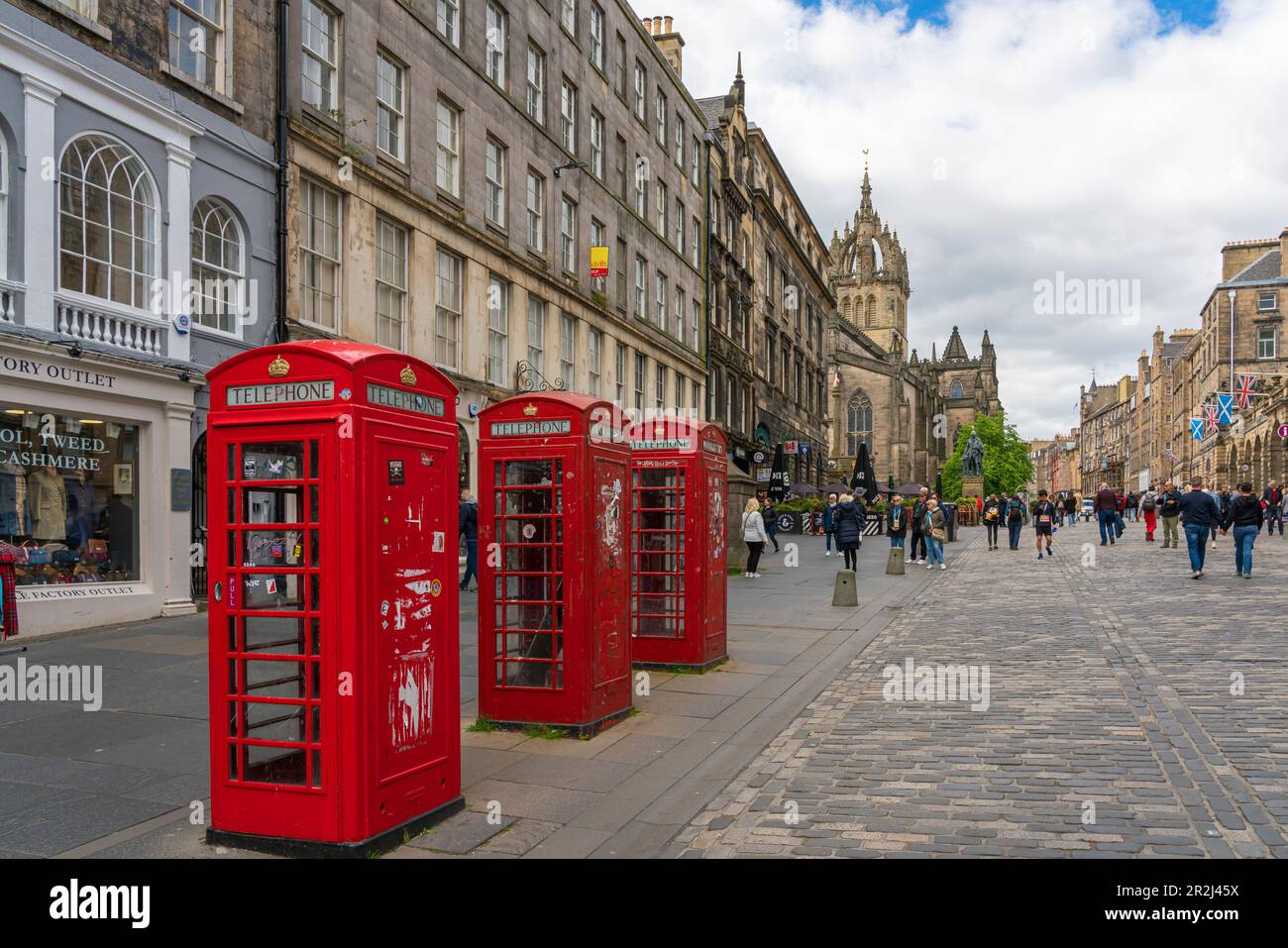 Red phone booths at Royal Mile with St. Giles Cathedral in background ...