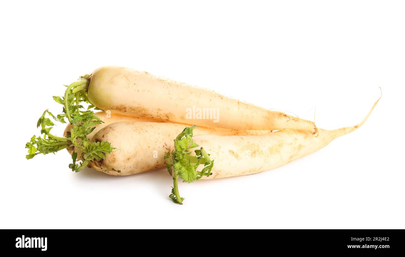 Fresh daikon radishes on white background Stock Photo - Alamy