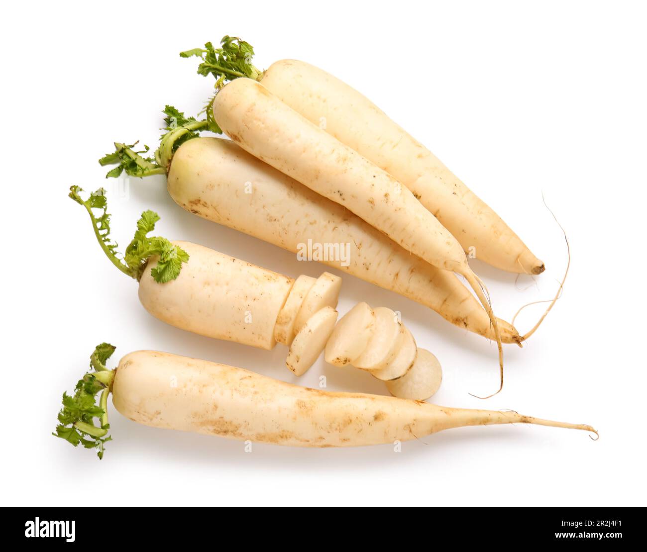 Fresh daikon radishes on white background Stock Photo - Alamy