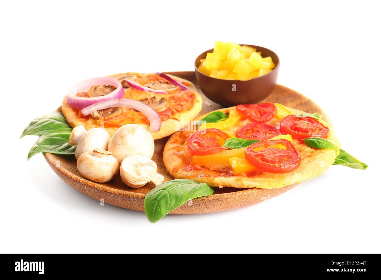 Plate with different tasty mini pizzas and ingredients on white ...
