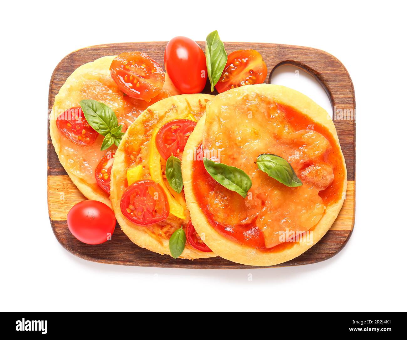 Board with tasty mini pizzas on white background Stock Photo - Alamy