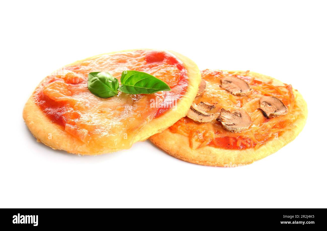 Different tasty mini pizzas on white background Stock Photo - Alamy