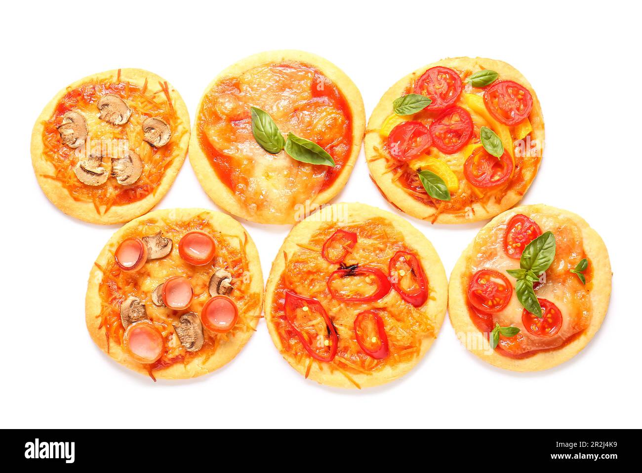 Different tasty mini pizzas on white background Stock Photo - Alamy