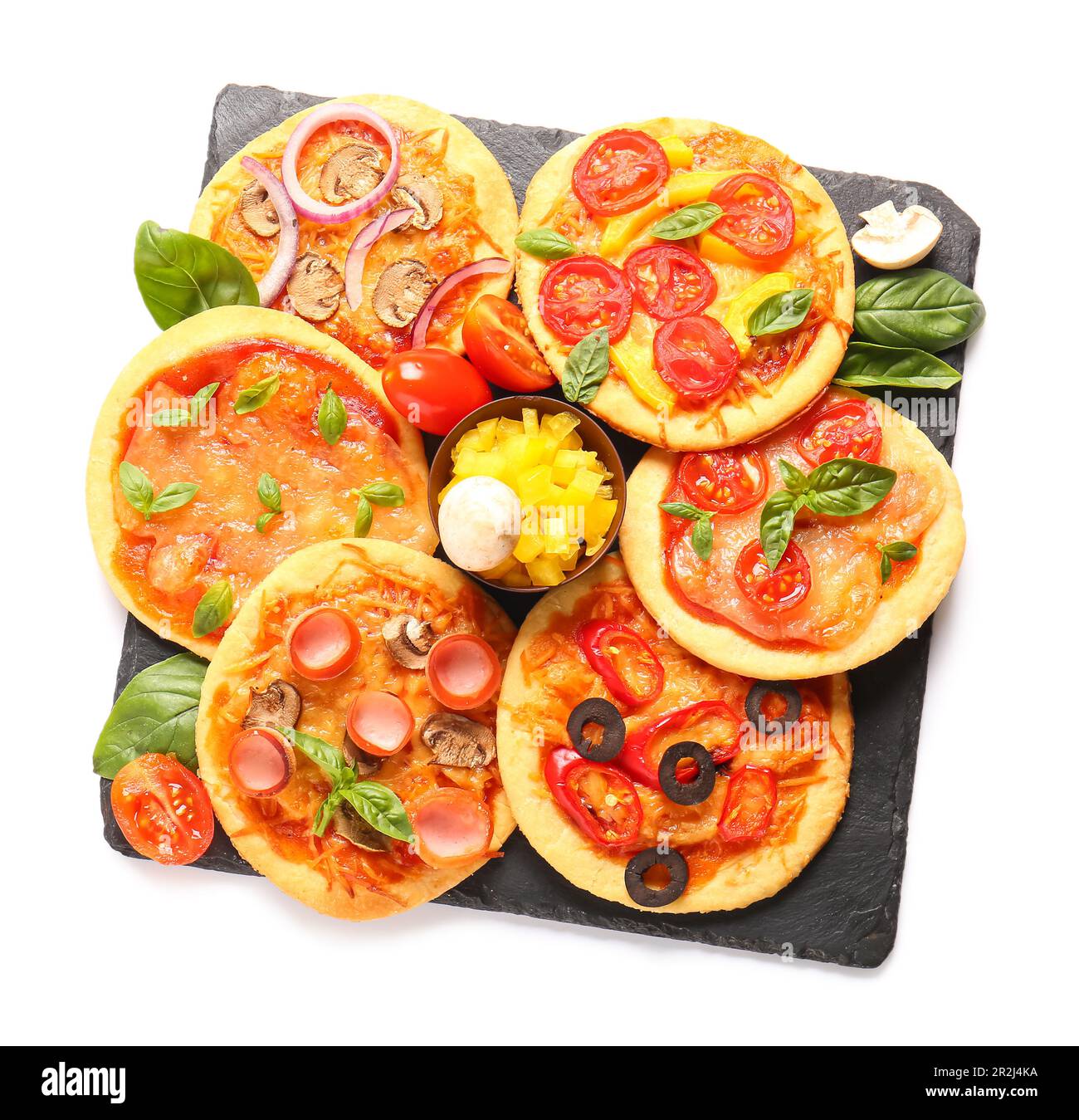 Board with different tasty mini pizzas on white background Stock Photo ...