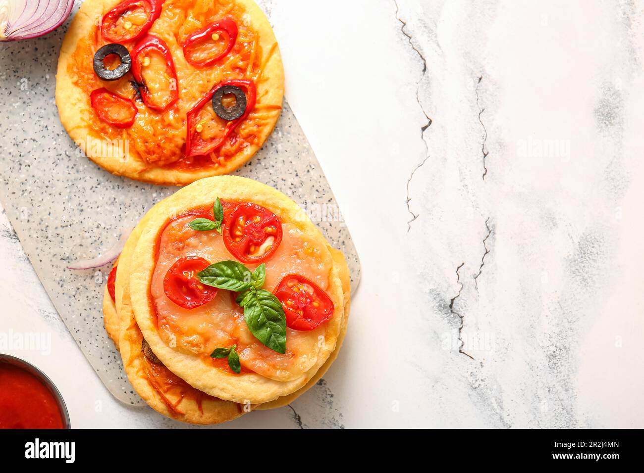 Board with different tasty mini pizzas on white background Stock Photo ...