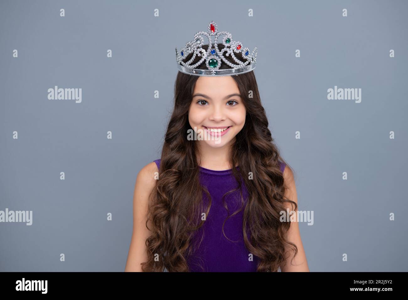 Portrait of ambitious teenage girl with crown, feeling princess ...