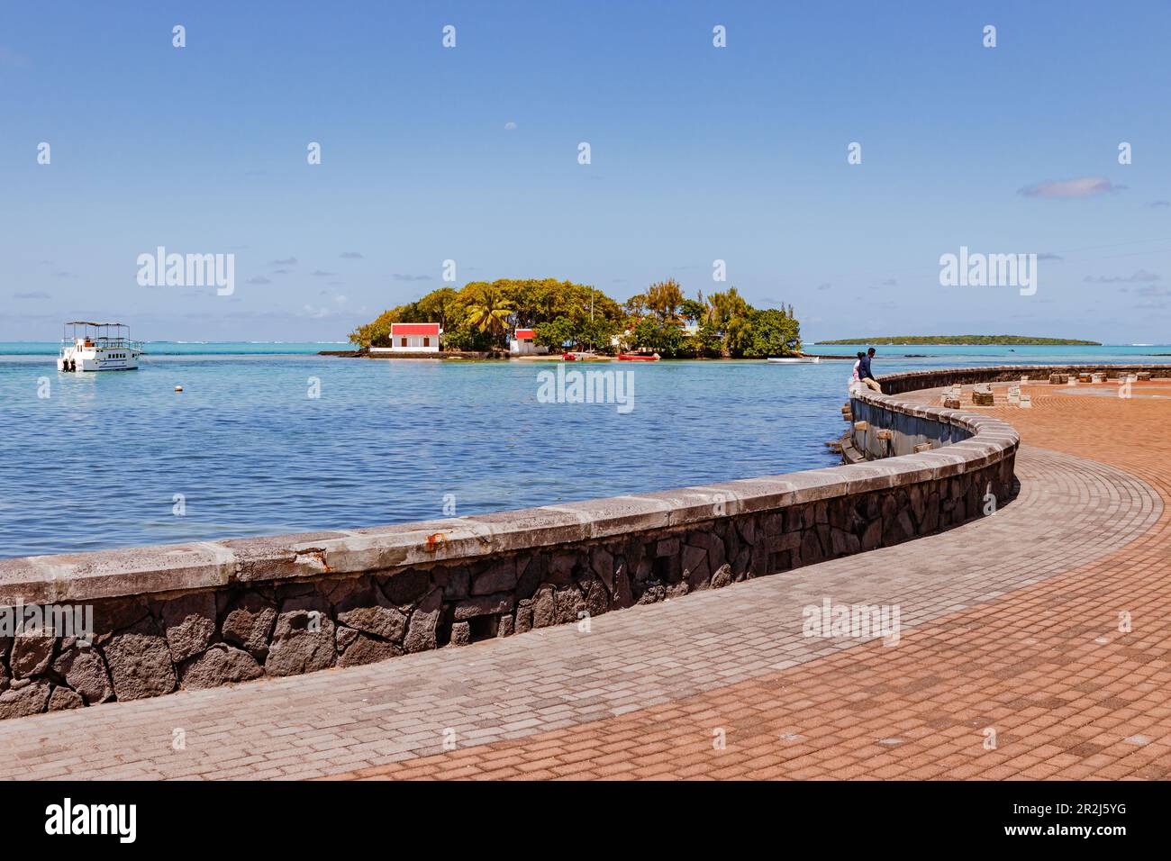 Idyllic promenade on the Mahebourg Waterfront coast in the southeast of ...