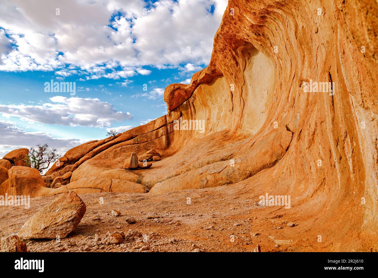 A semicircular crater with prominent rocks in the Spitzkoppe inselberg ...