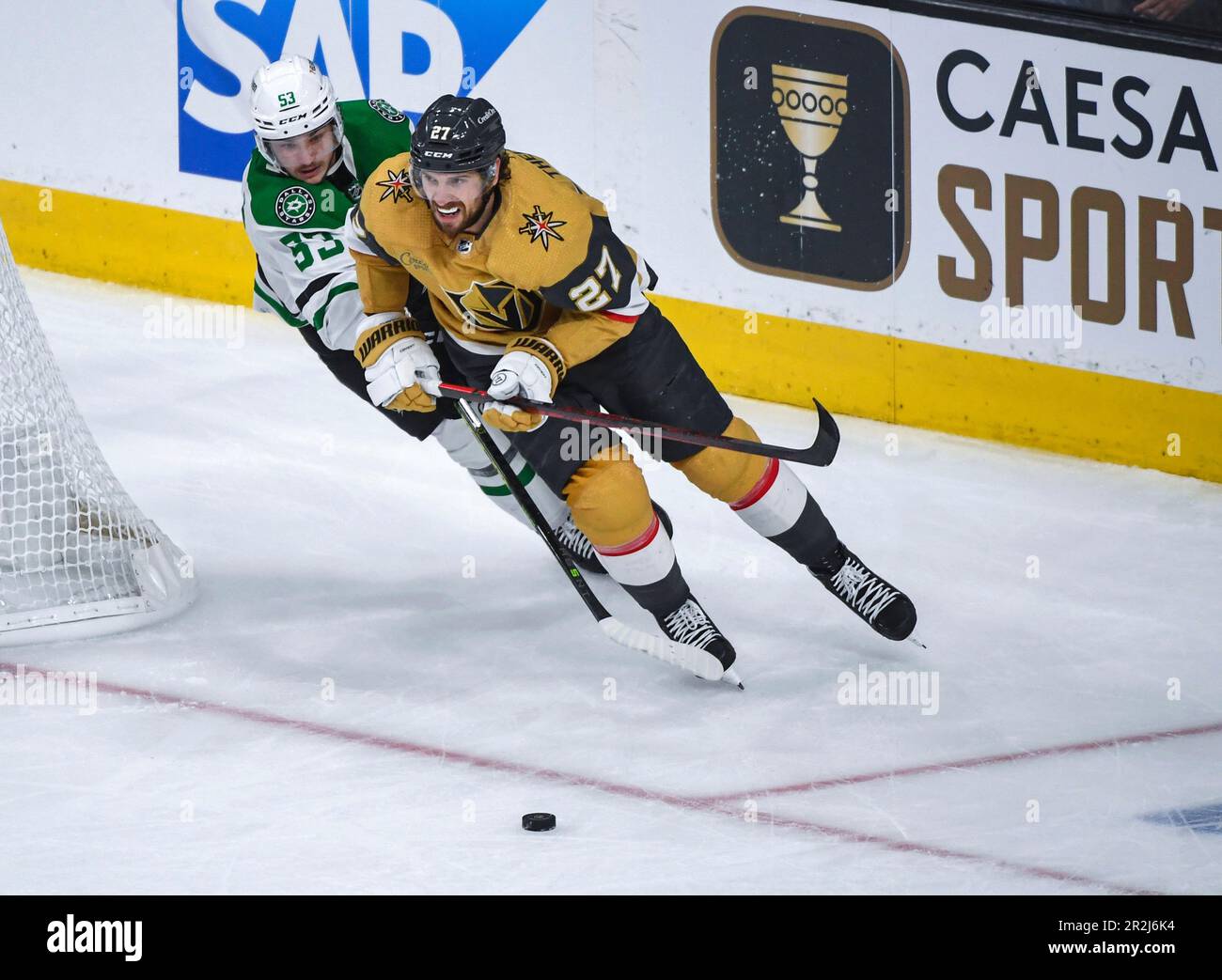 Vegas Golden Knights defenseman Shea Theodore (27) is pursued by Dallas ...