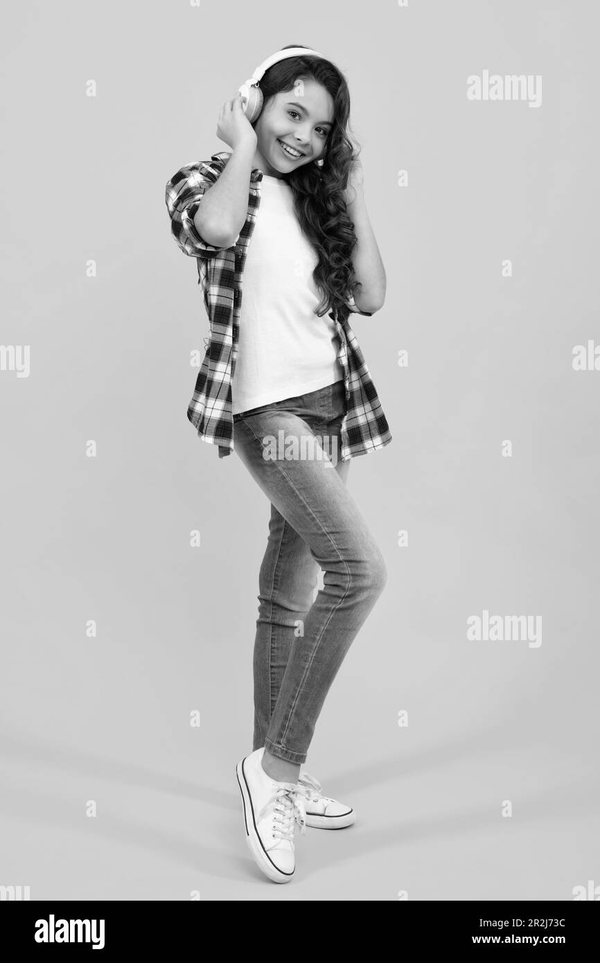 Child music concept. Teenager child girl dances in rhythm of melody ...