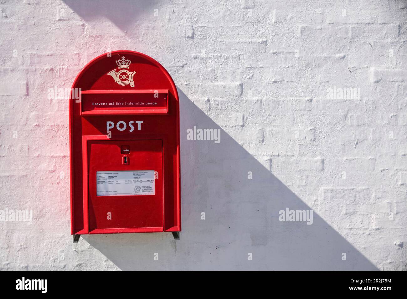 Red Danish mailbox at the ruins of Hammershus Fortress on Bornholm ...