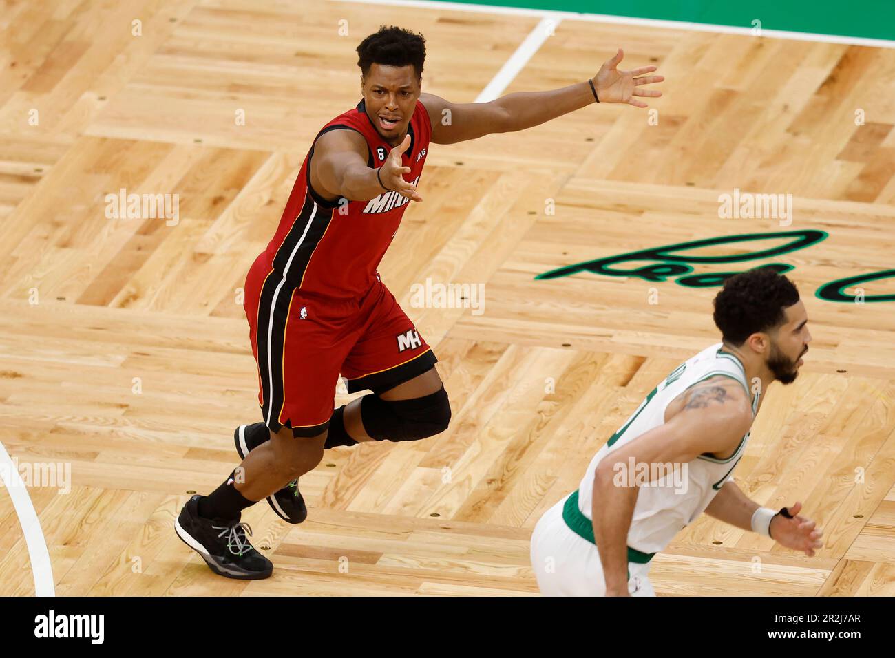 Miami Heat guard Kyle Lowry, left, reacts toward officials during the ...
