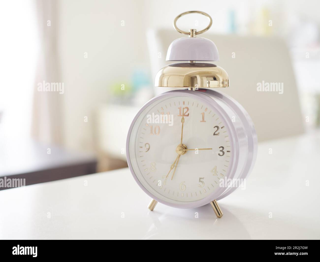 Alarm clock at 7 a.m Stock Photo - Alamy