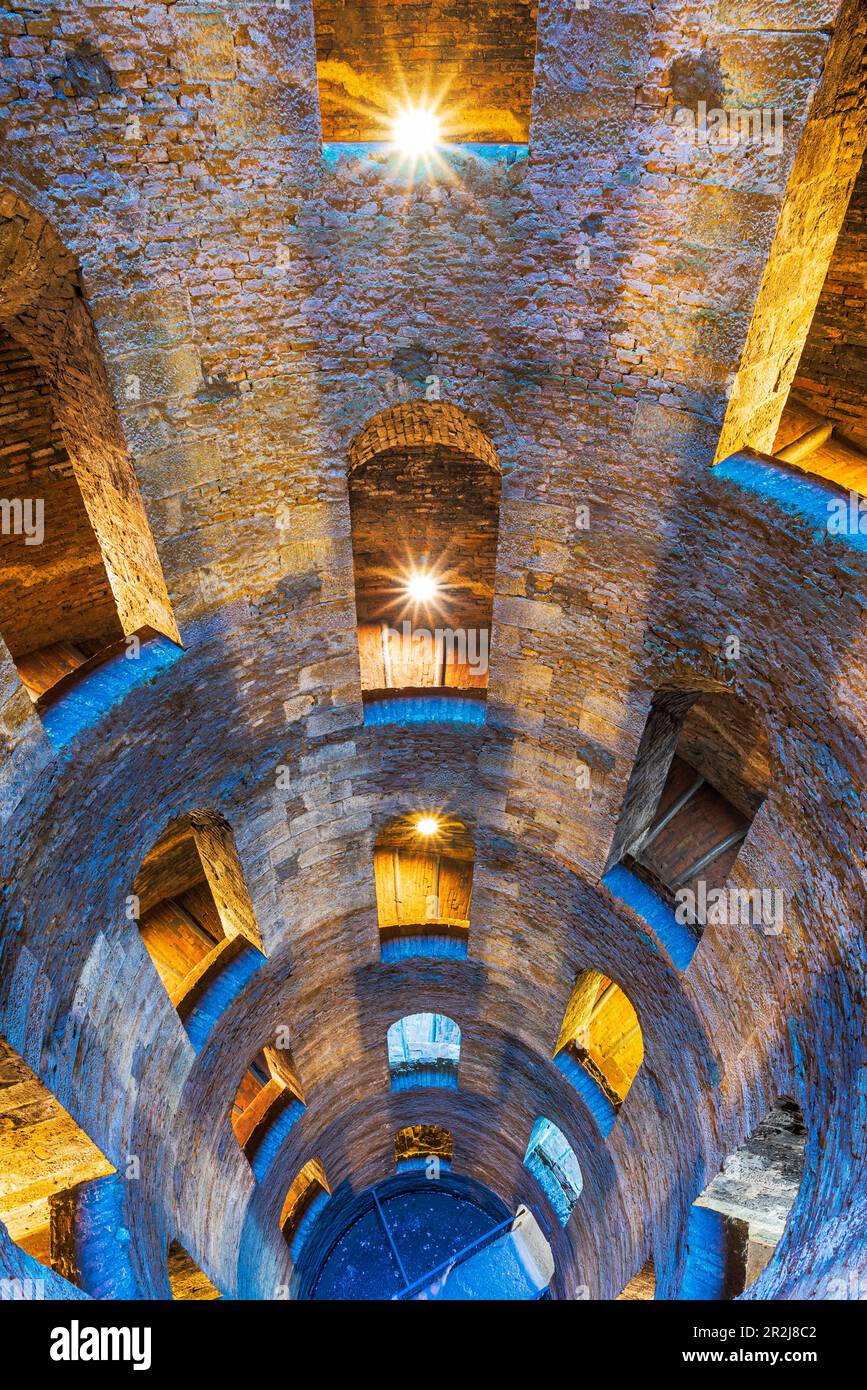 Illuminated view of the bottom of Saint Patrick's well with a spiral ...