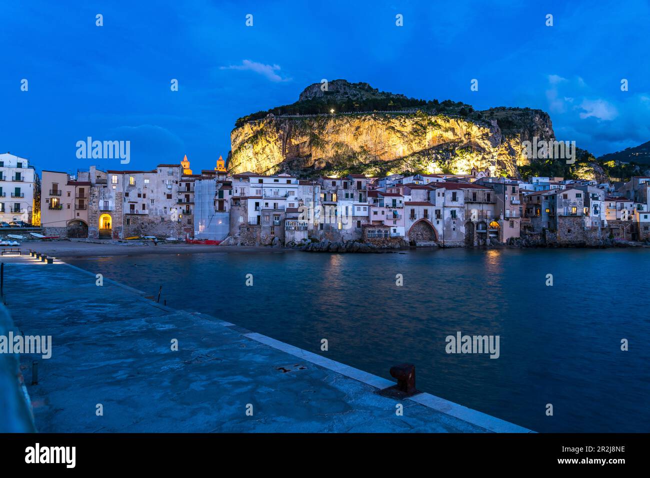 Old town of Cefalu and rock Rocca di Cefalu at dusk, Cefalu, Sicily ...