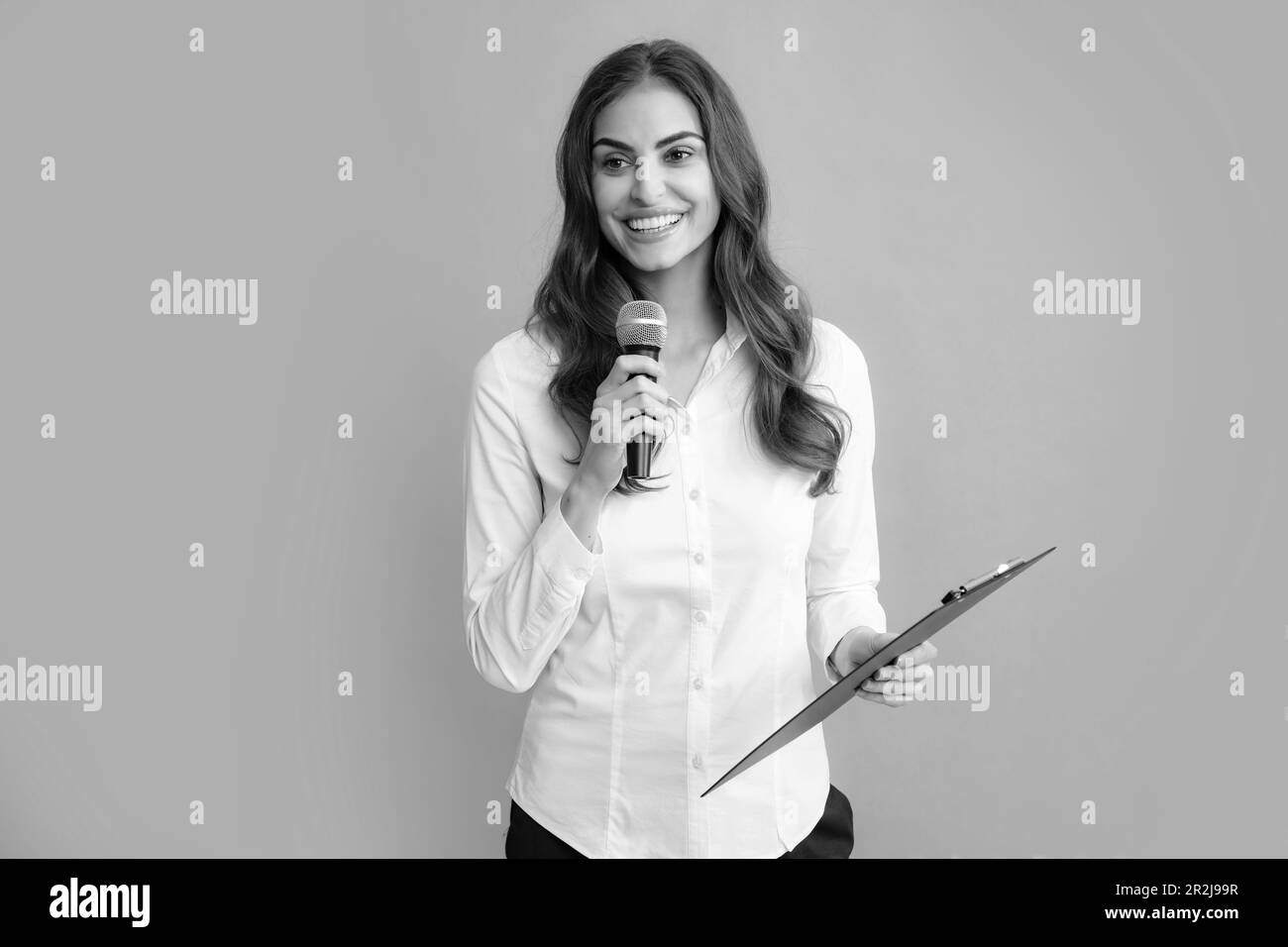 Portrait of young smiling business woman doing presentation with ...