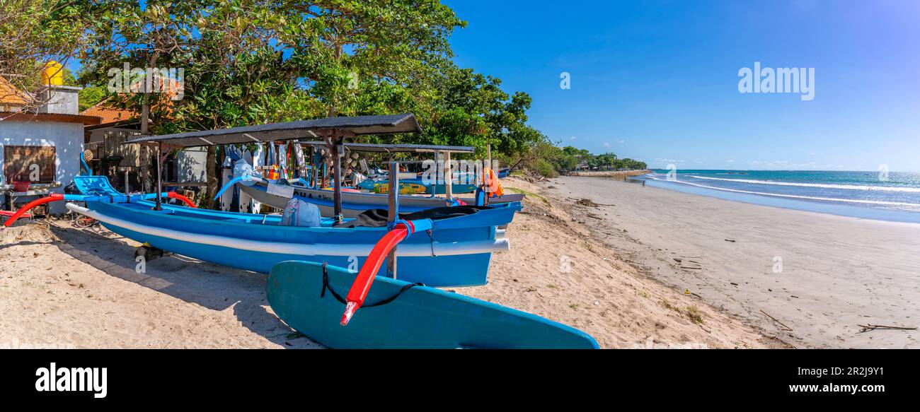 View of fishing outrigger overlooking Kuta Beach, Kuta, Bali, Indonesia ...