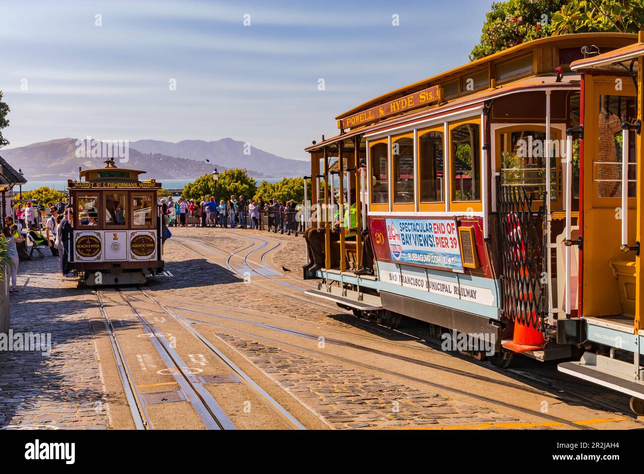 Two cable cars and a crowd boarding at Hyde Street Station, San ...