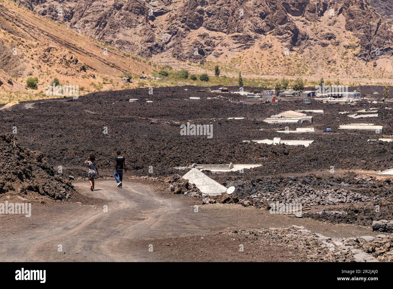 Lava rocks and destroyed houses in the volcanic crater of Pico do Fogo ...
