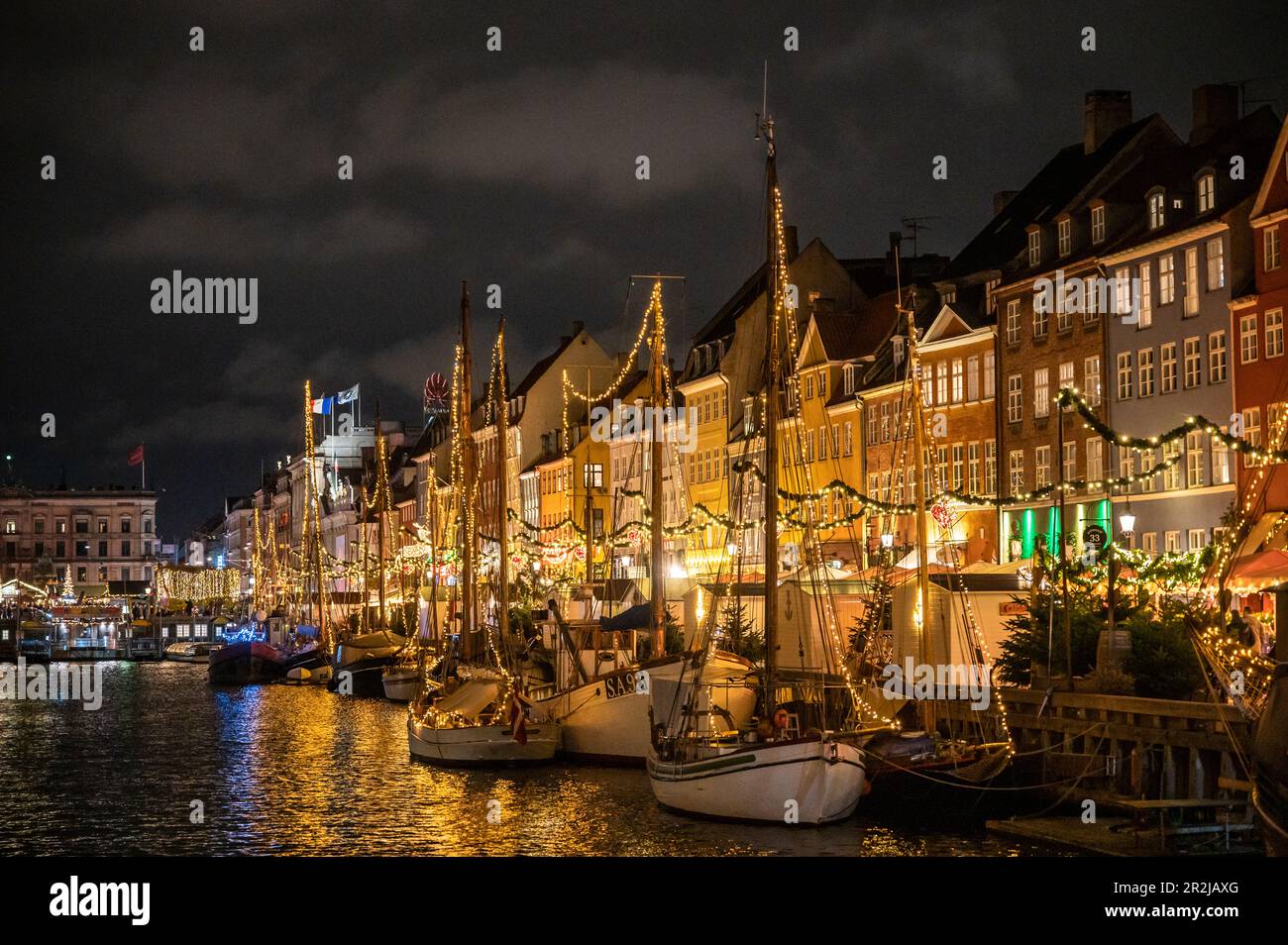 View of the harbor of Nyhavn in Copenhagen in the evening in Advent ...