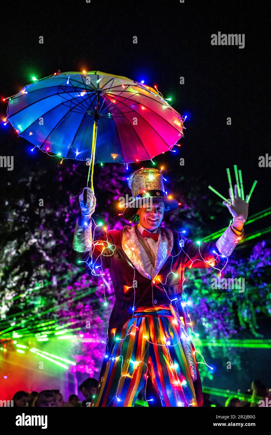Illuminated stilt walkers at a festival of lights Stock Photo - Alamy
