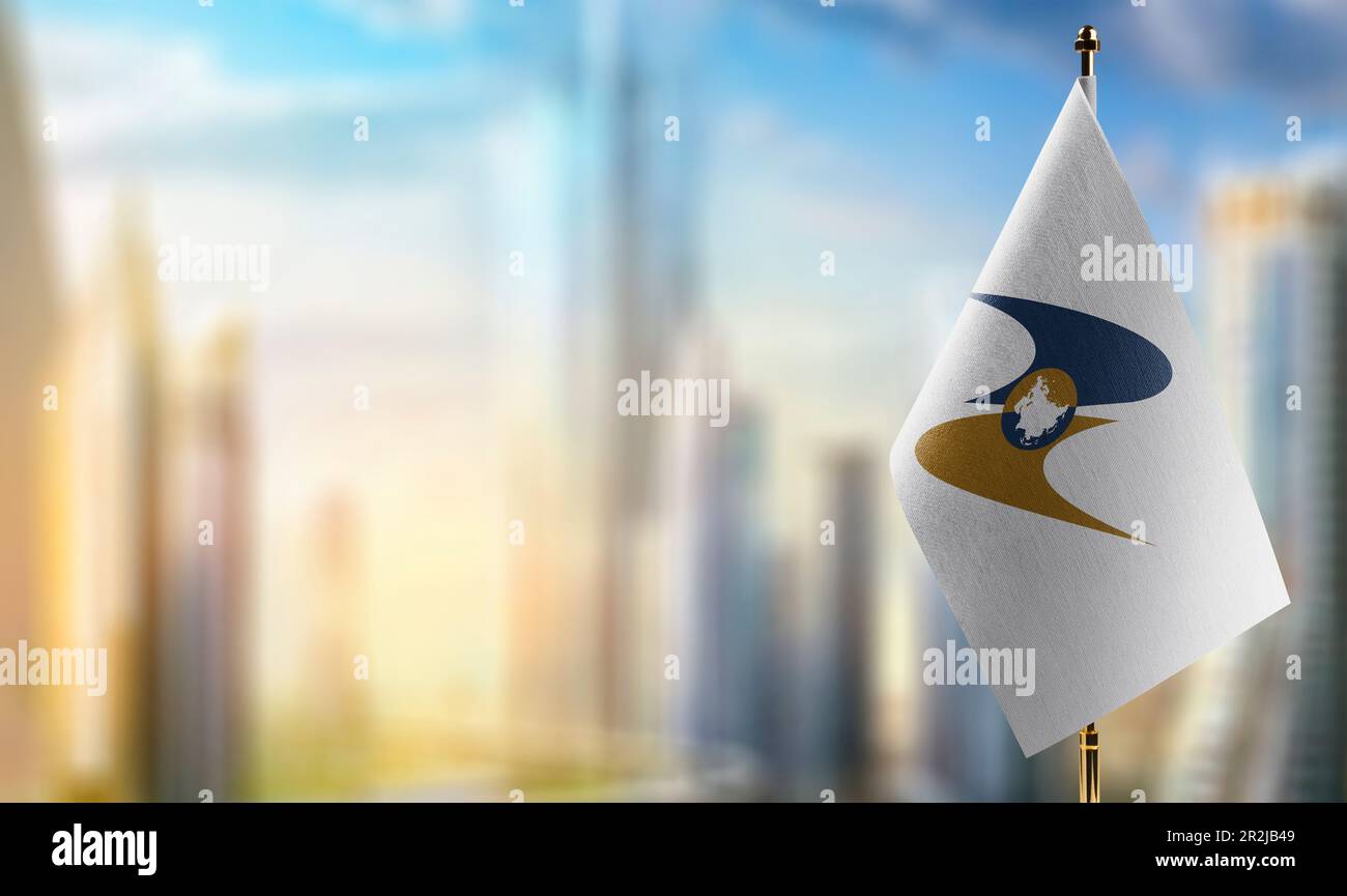 Small flags of the Eurasian Economic Union on an abstract blurry ...