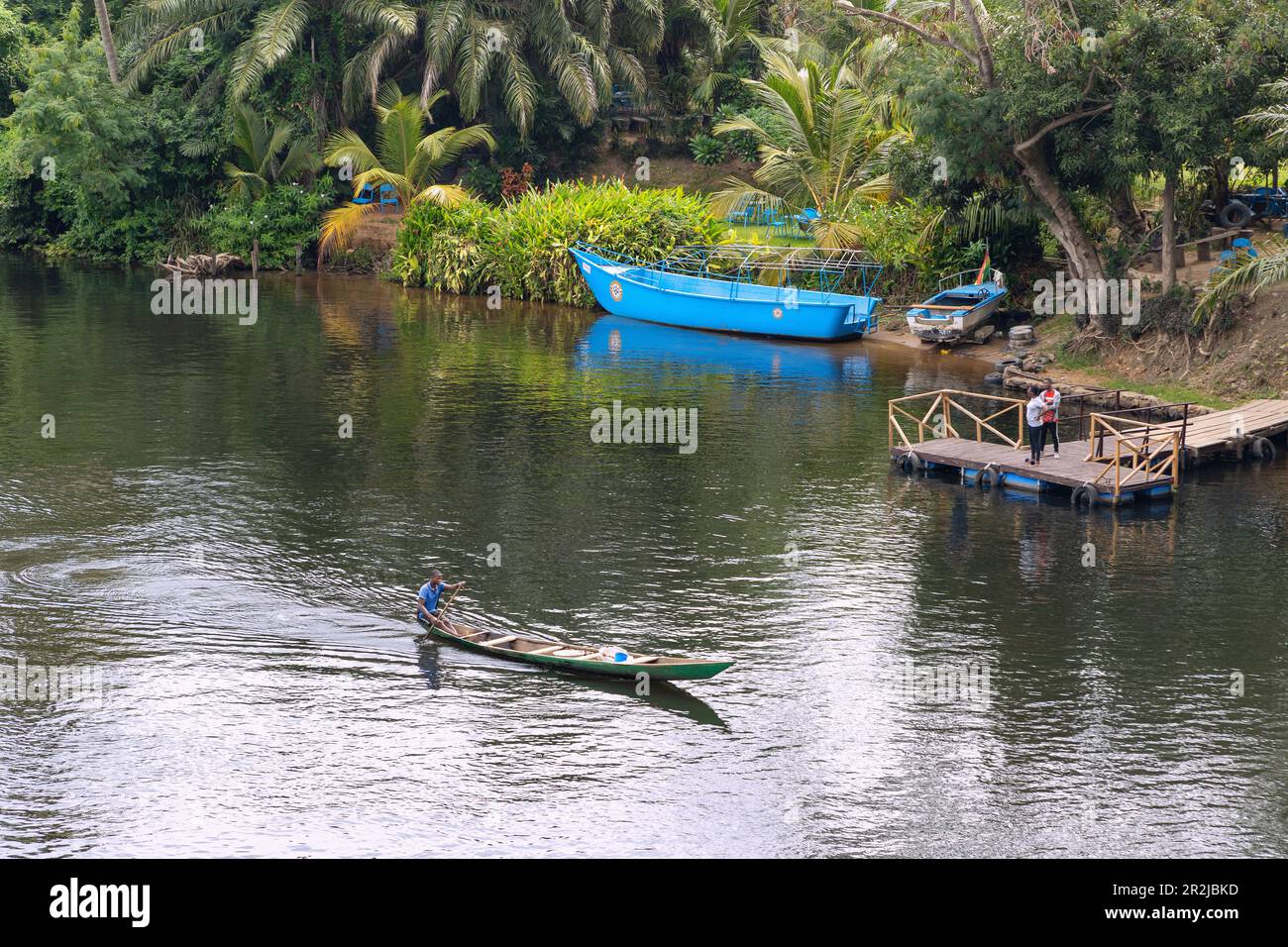 Fisherman in a pirogue on the Volta River, view from the Volta Bridge ...