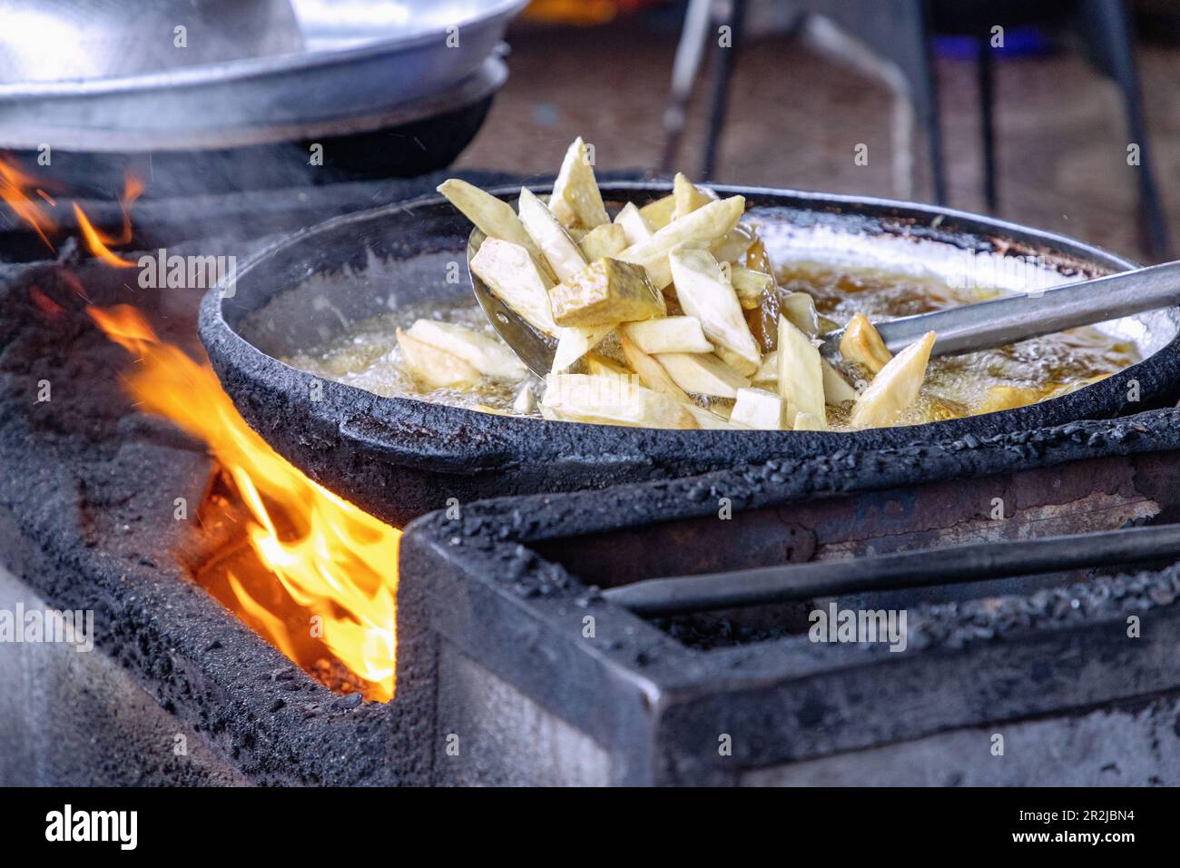 Street food stall selling fried yams in Ayinam in the Eastern Region of ...