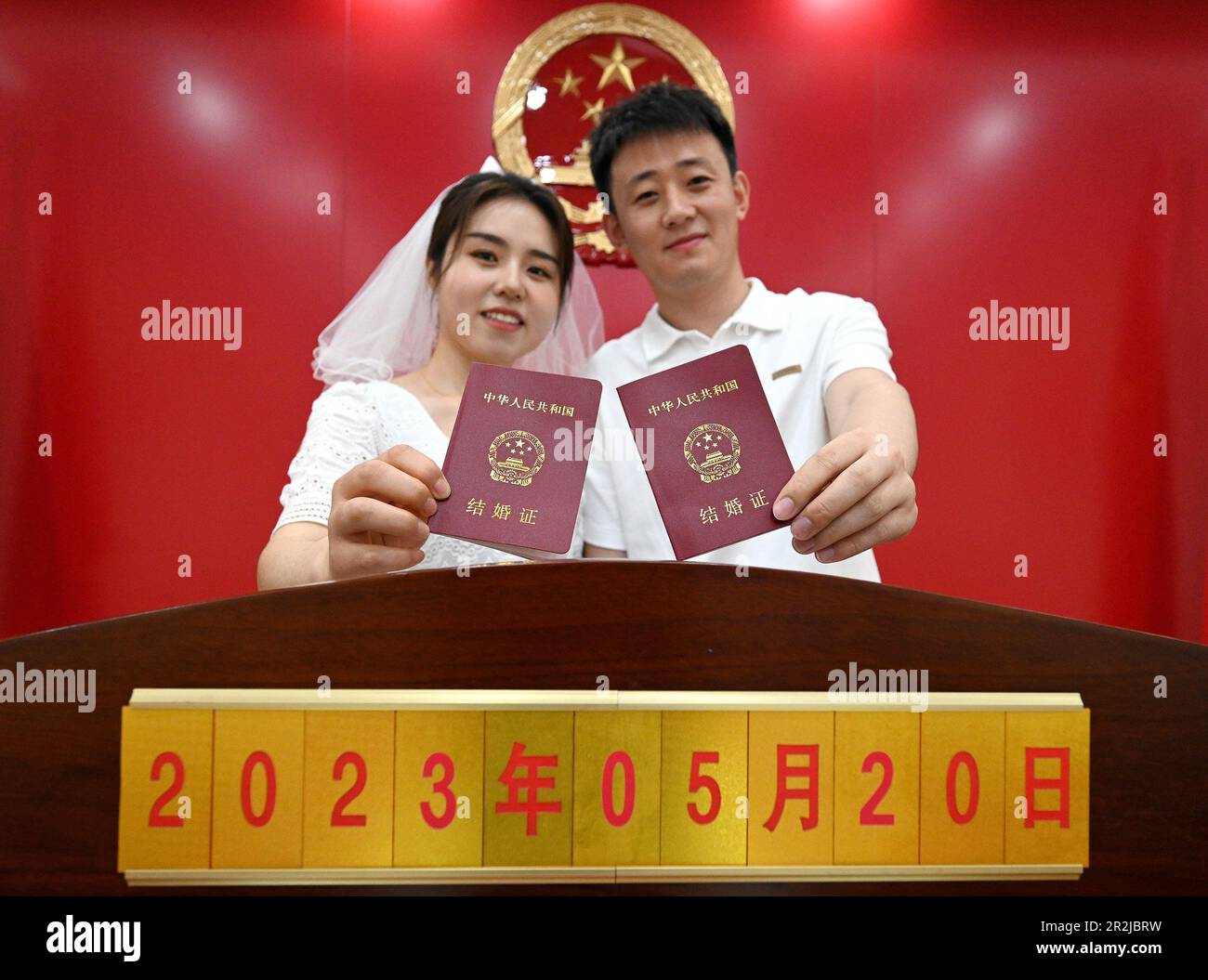 HANDAN, CHINA - MAY 20, 2023 - A couple shows their newly obtained ...