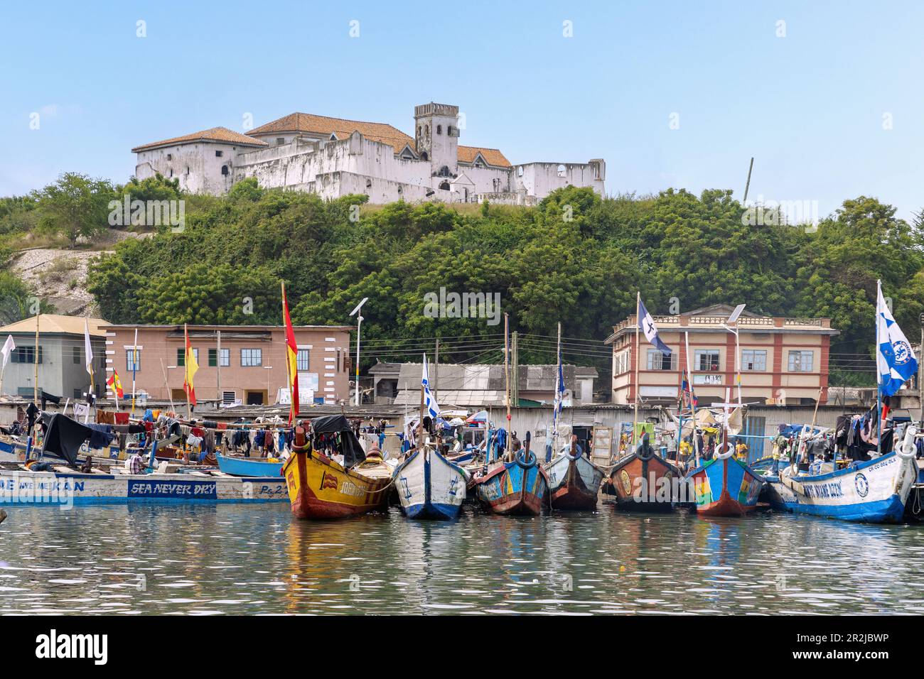 Fishing port in Elmina looking towards the Fortress of São Jago da Mina ...