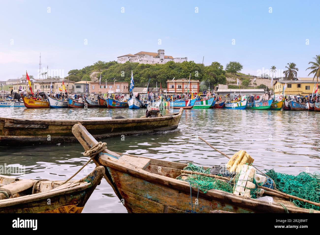Fishing port in Elmina looking towards the Fortress of São Jago da Mina ...