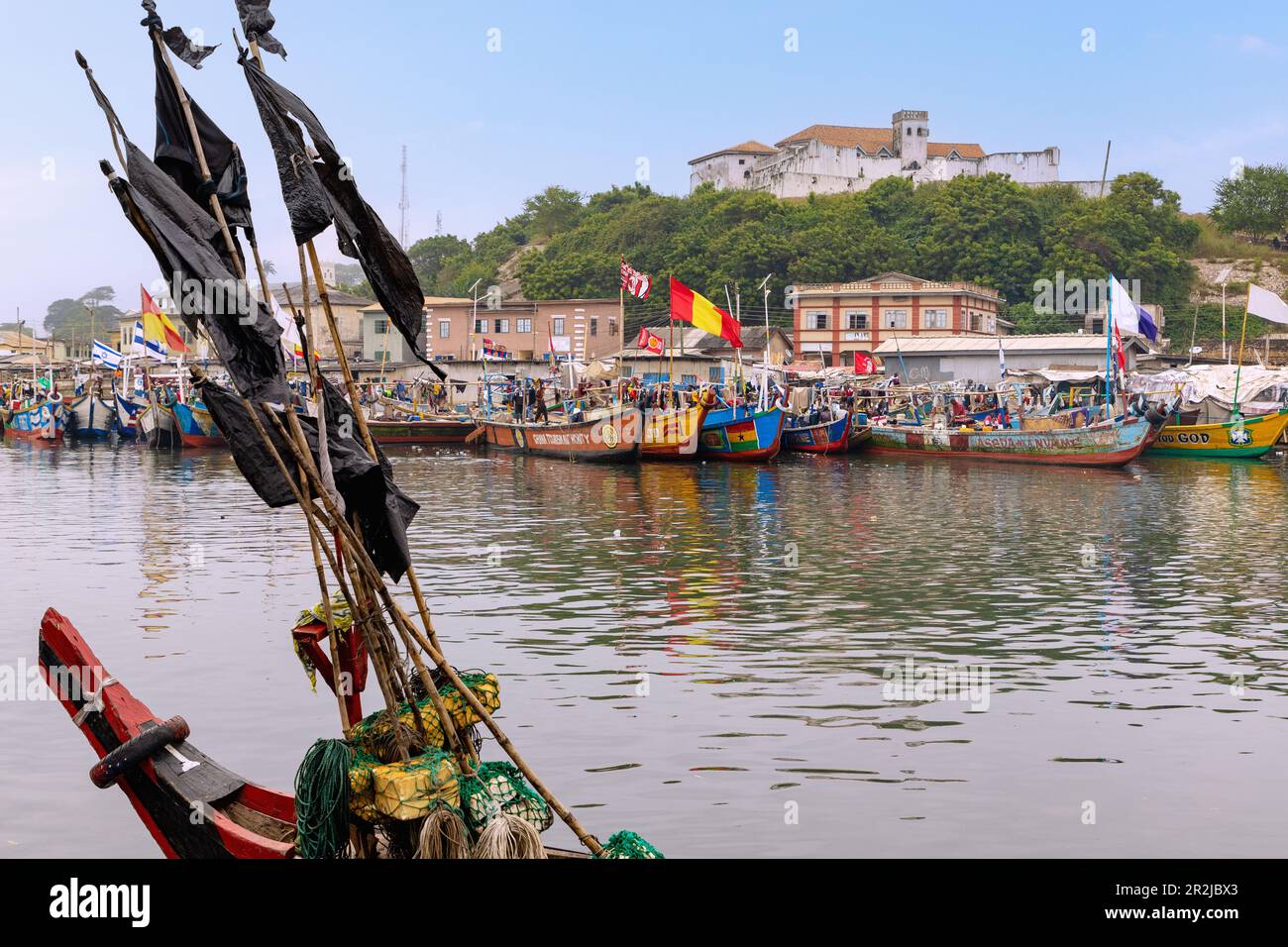 Fishing port in Elmina looking towards the Fortress of São Jago da Mina ...