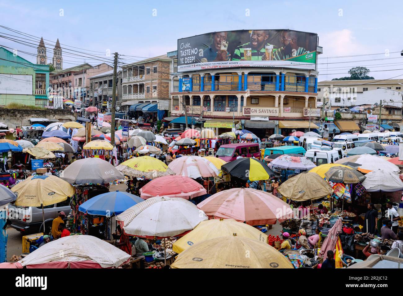 Central Market with a view of St Peter's Cathedral Basilica in Kumasi ...
