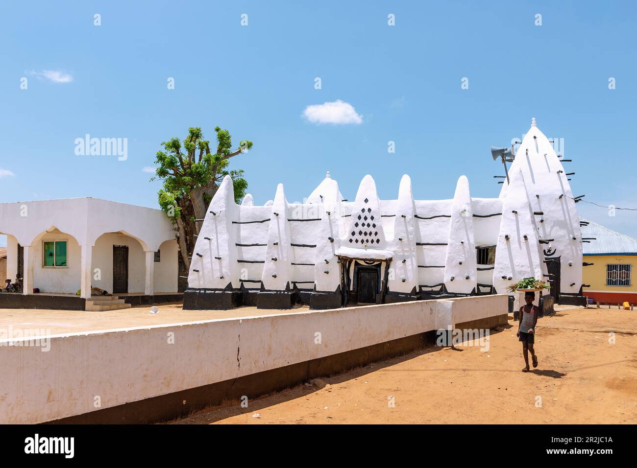 Larabanga Mosque with baobab, main entrance of men, muezzin and imam's ...