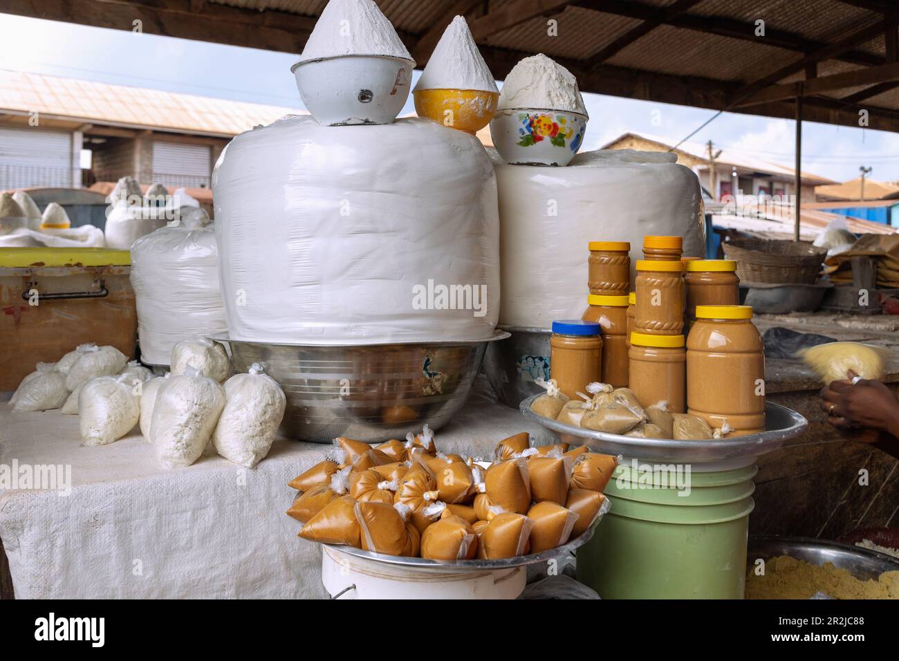 Selling cassava flour, tapioca and peanut butter at the weekly market ...