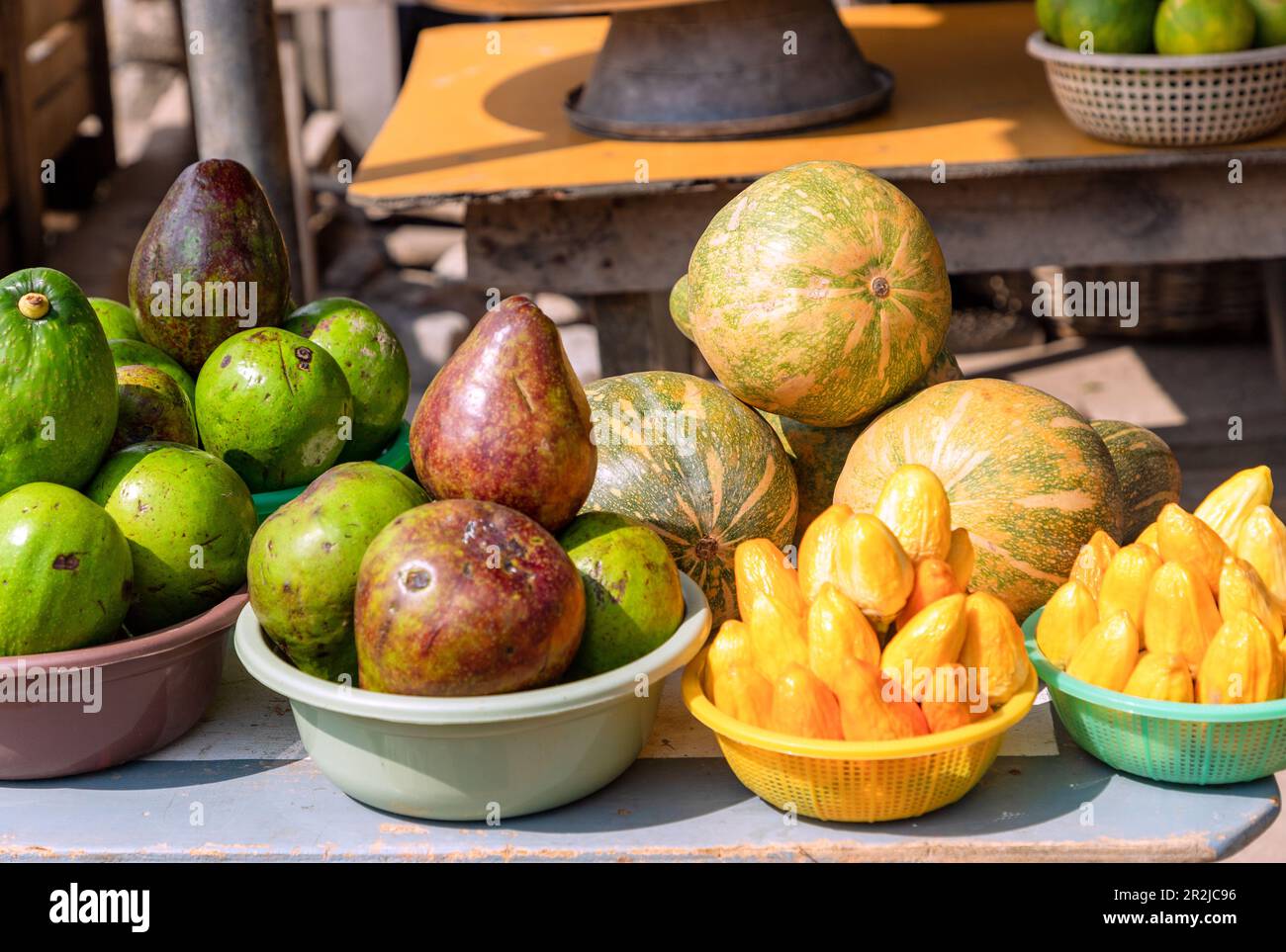 Street sale of mangoes, melons, avocado and jackfruit in Winneba in the ...