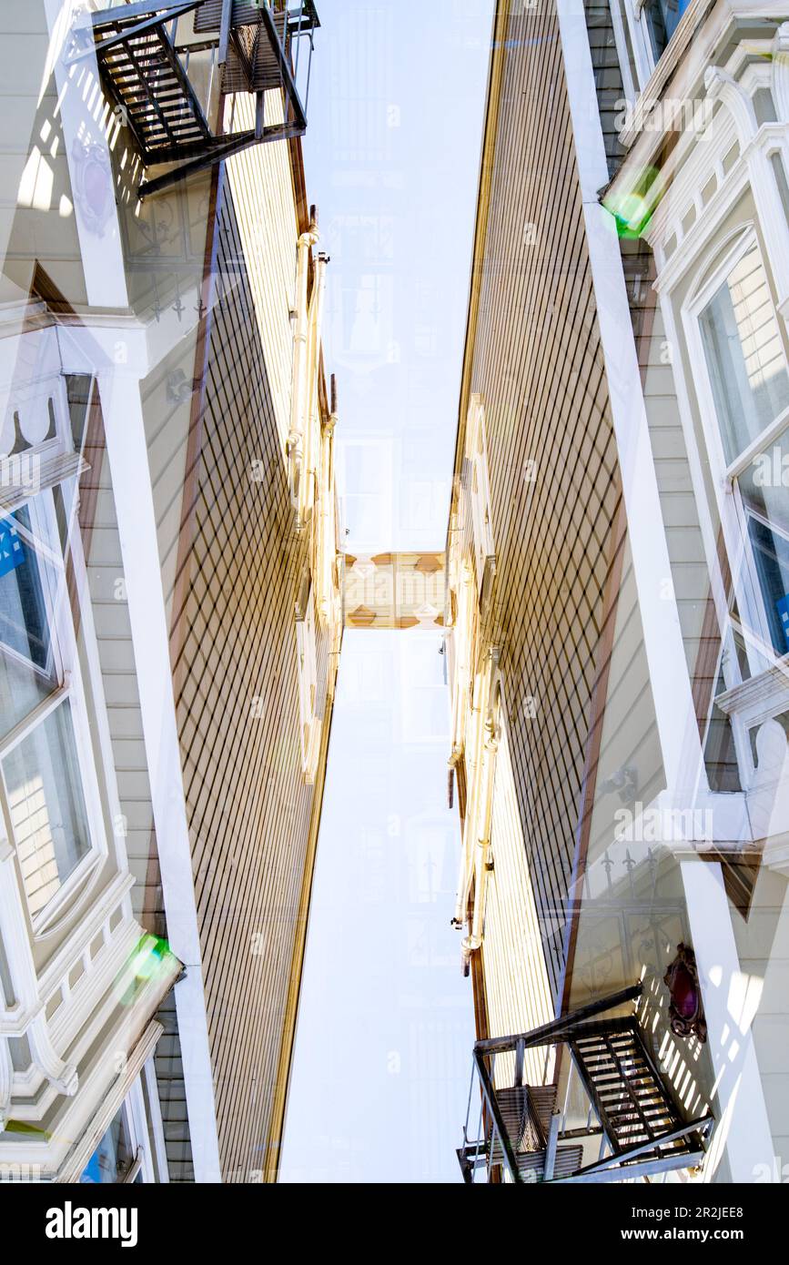 Double exposure of the space between two wooden residential buildings ...