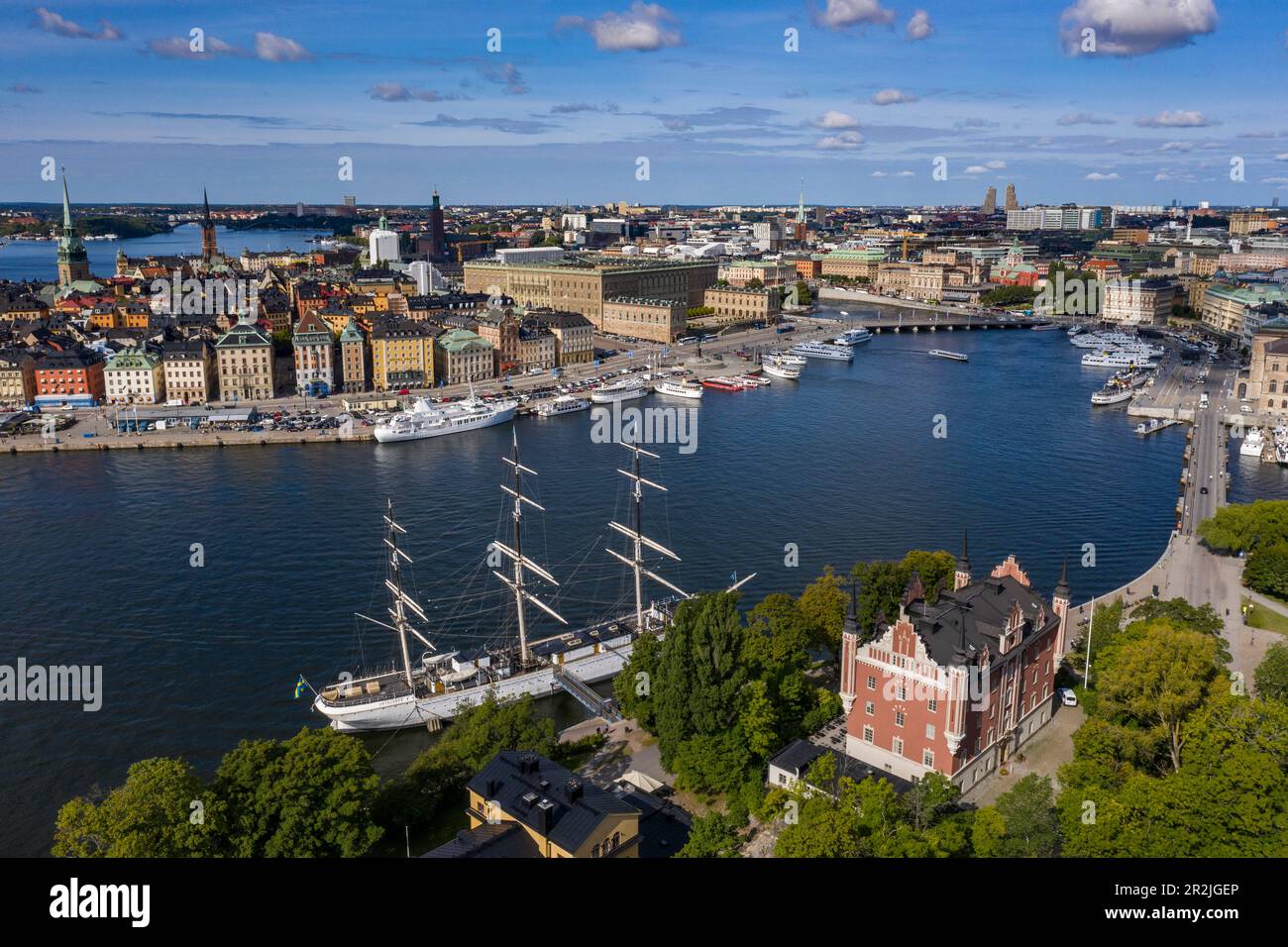 Aerial view of sailing ship (with youth hostel) af Chapman with Gamla Stan old town behind ...