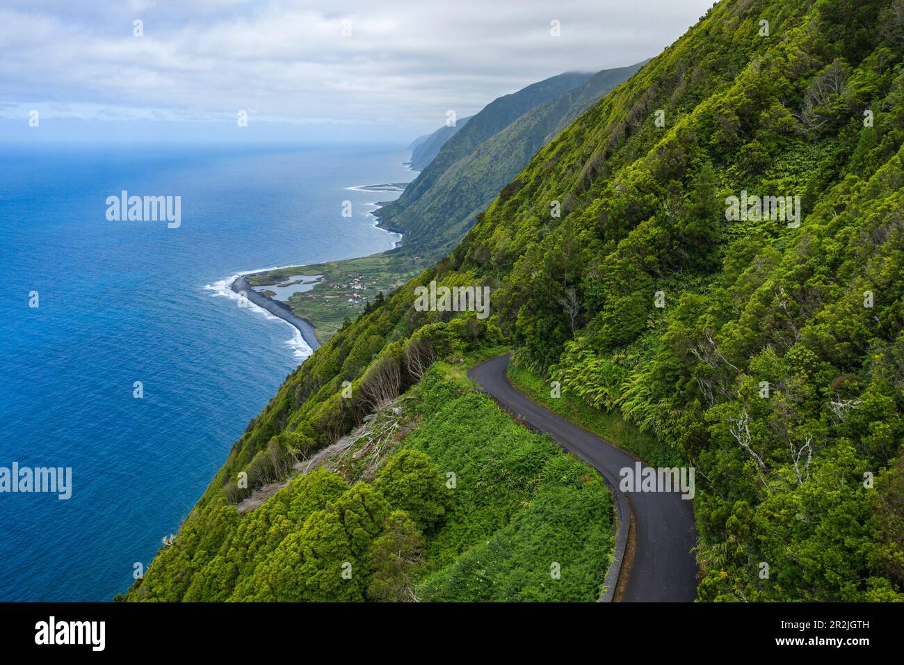 Aerial view of road along forested coast by the sea, Norte Pequeno, Sao ...