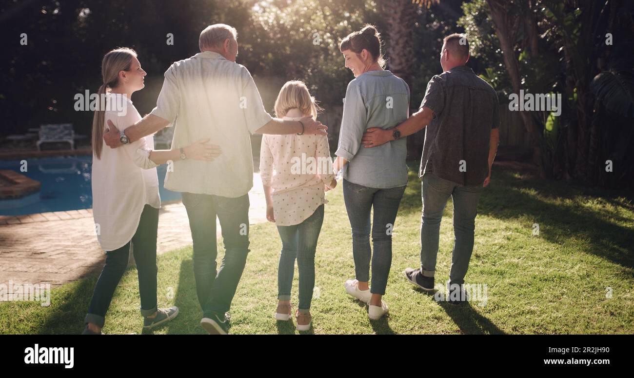 Back, hug and a family in a backyard for sunshine, summer and ...