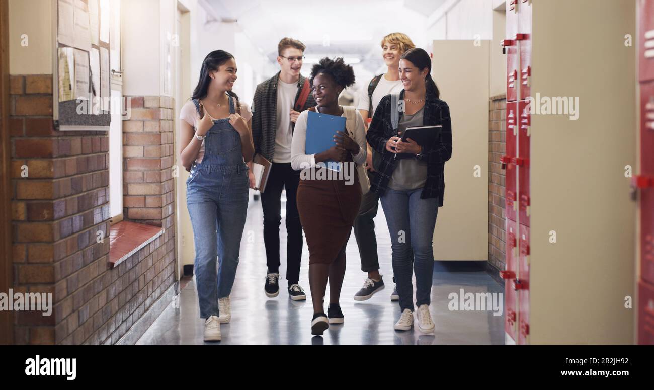 Happy, school diversity and students in a hallway for education ...