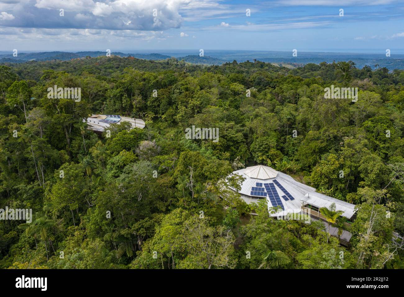 Aerial view of buildings in Veragua Rainforest Park with Caribbean Sea ...