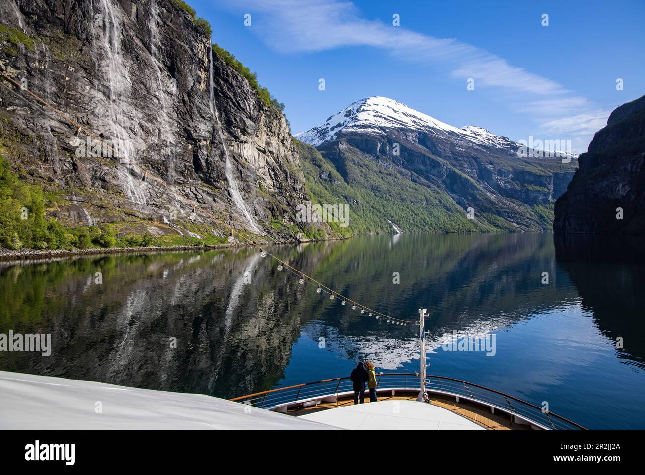 Couple on bow of expedition cruise ship World Voyager (nicko cruises ...