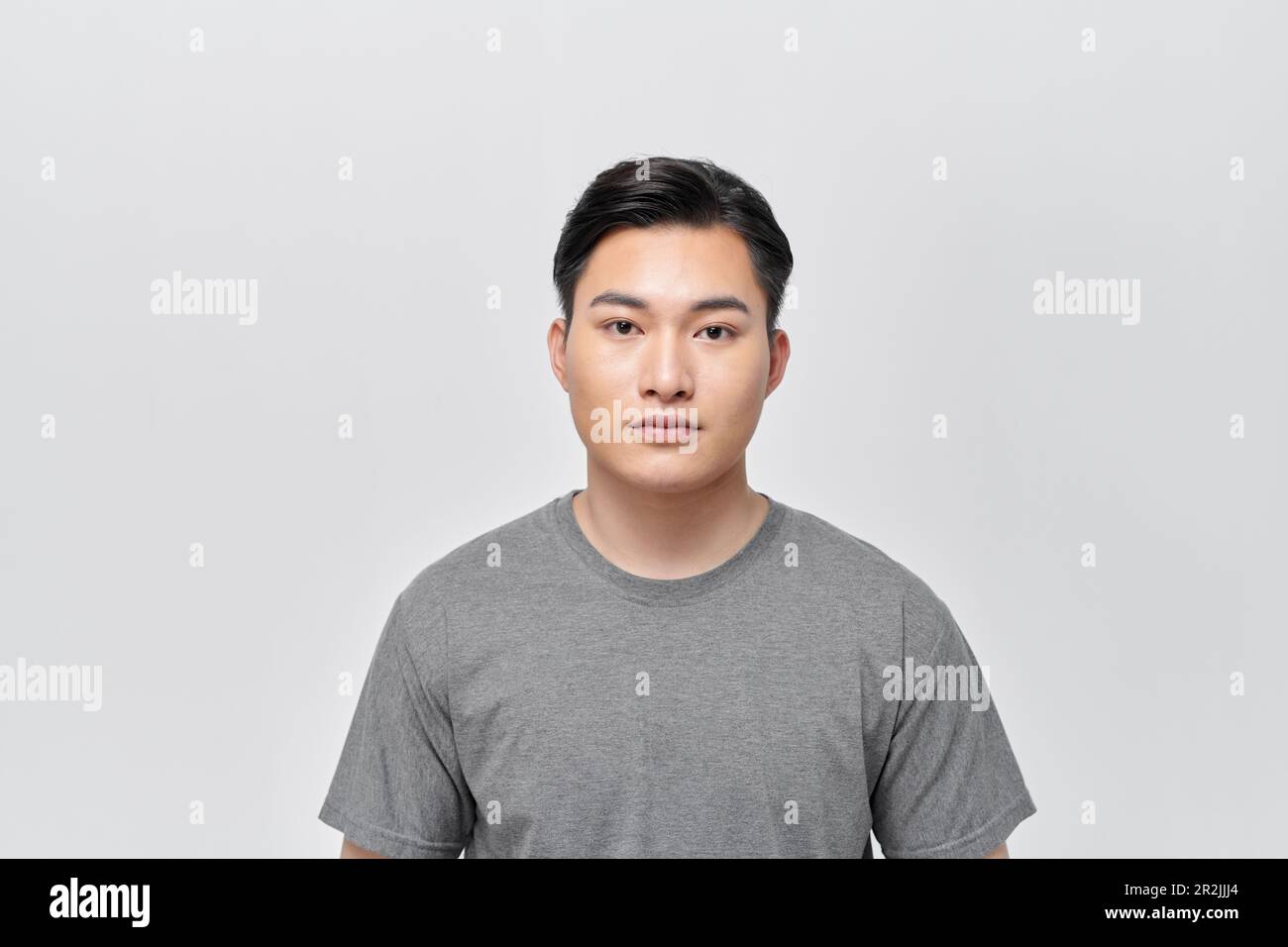 Face of handsome Asian man looking at camera Stock Photo - Alamy